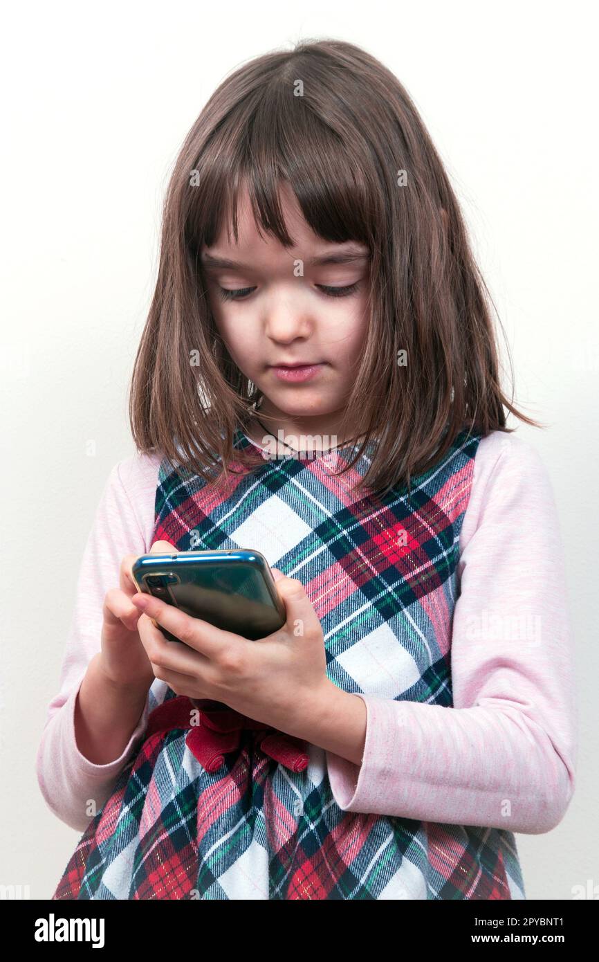 Little child girl with the phone Stock Photo - Alamy