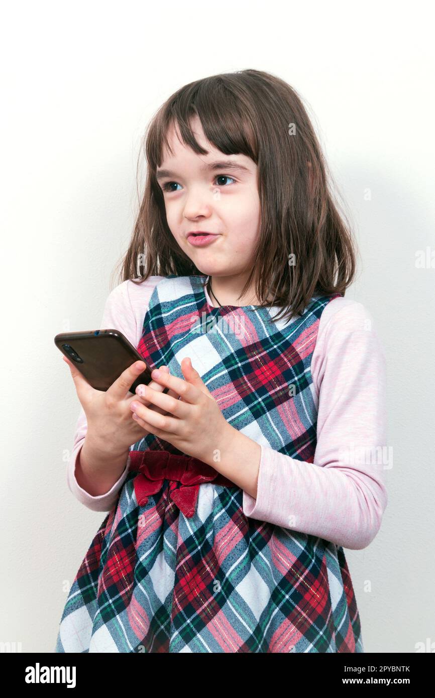 Little child girl with the phone Stock Photo - Alamy