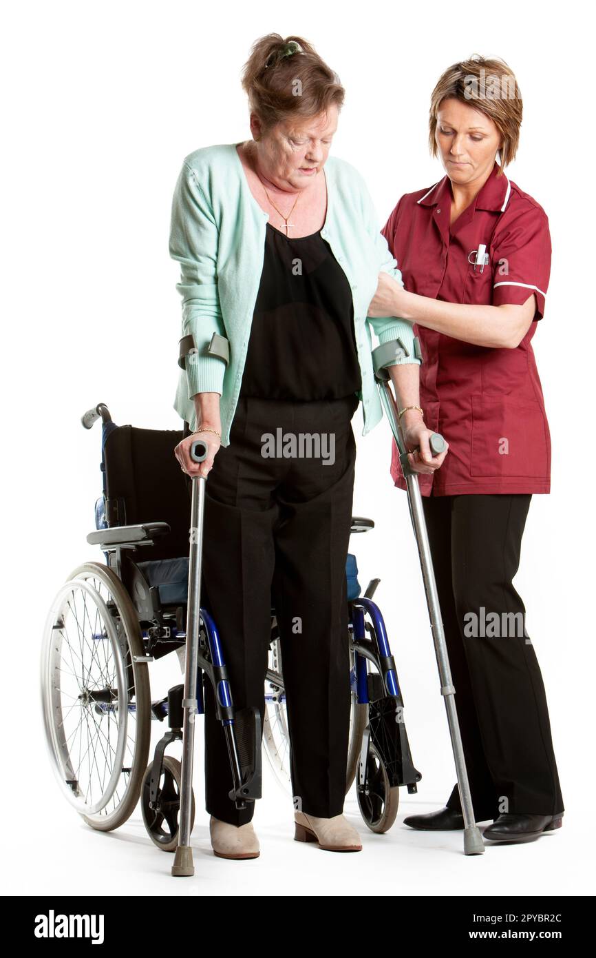 Health Professionals: Rehabilitation. A senior lady being helped out of ...