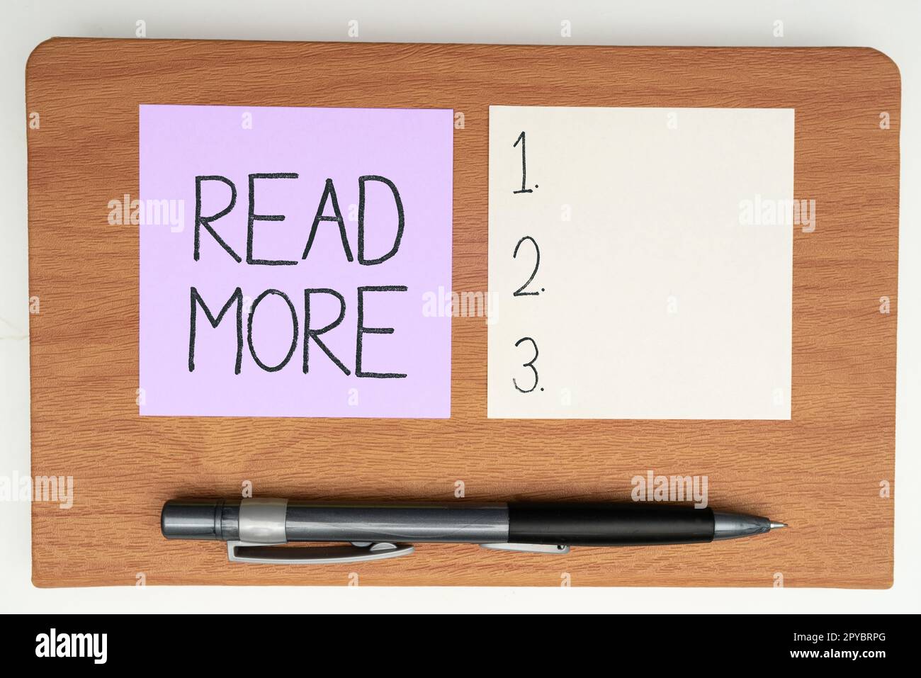 Sign displaying Read More. Business idea Provide more time or thorough ...
