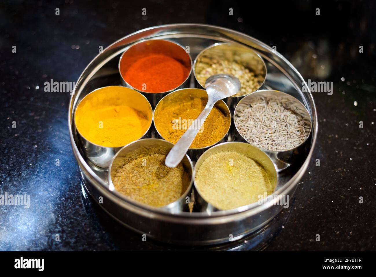 Traditional way of preparing indian food - fresh herbs and spices ...