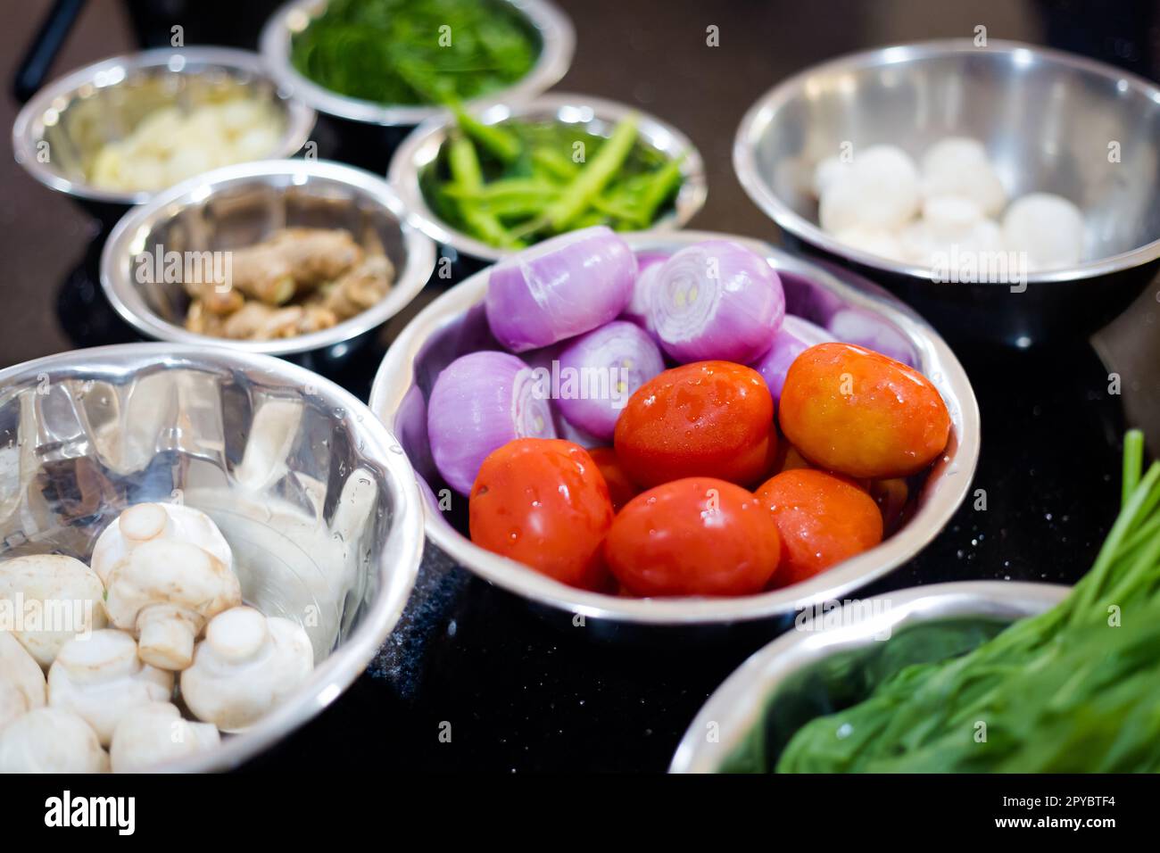Traditional way of preparing indian food - fresh herbs and spices ...