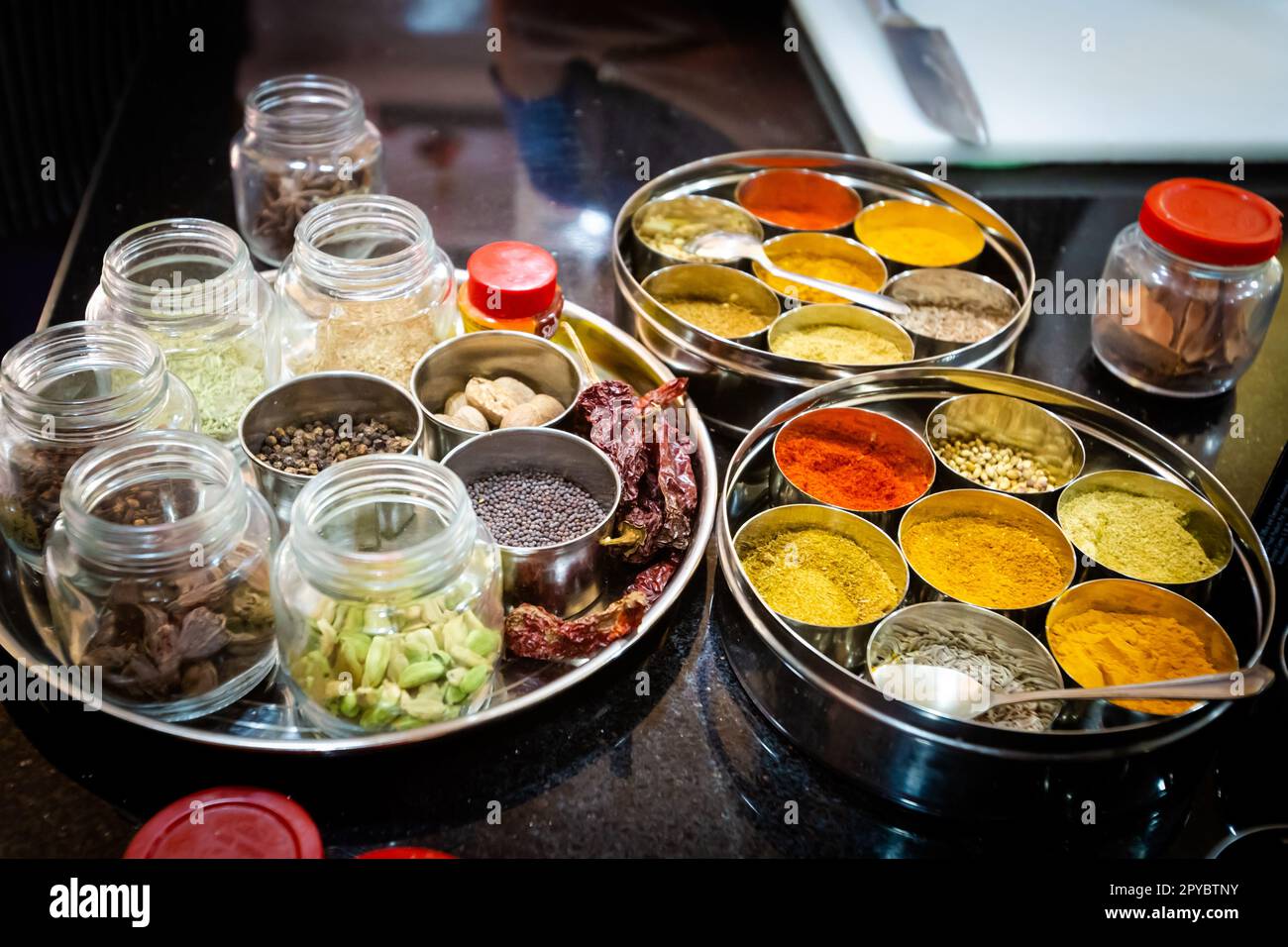 Traditional way of preparing indian food - fresh herbs and spices ...