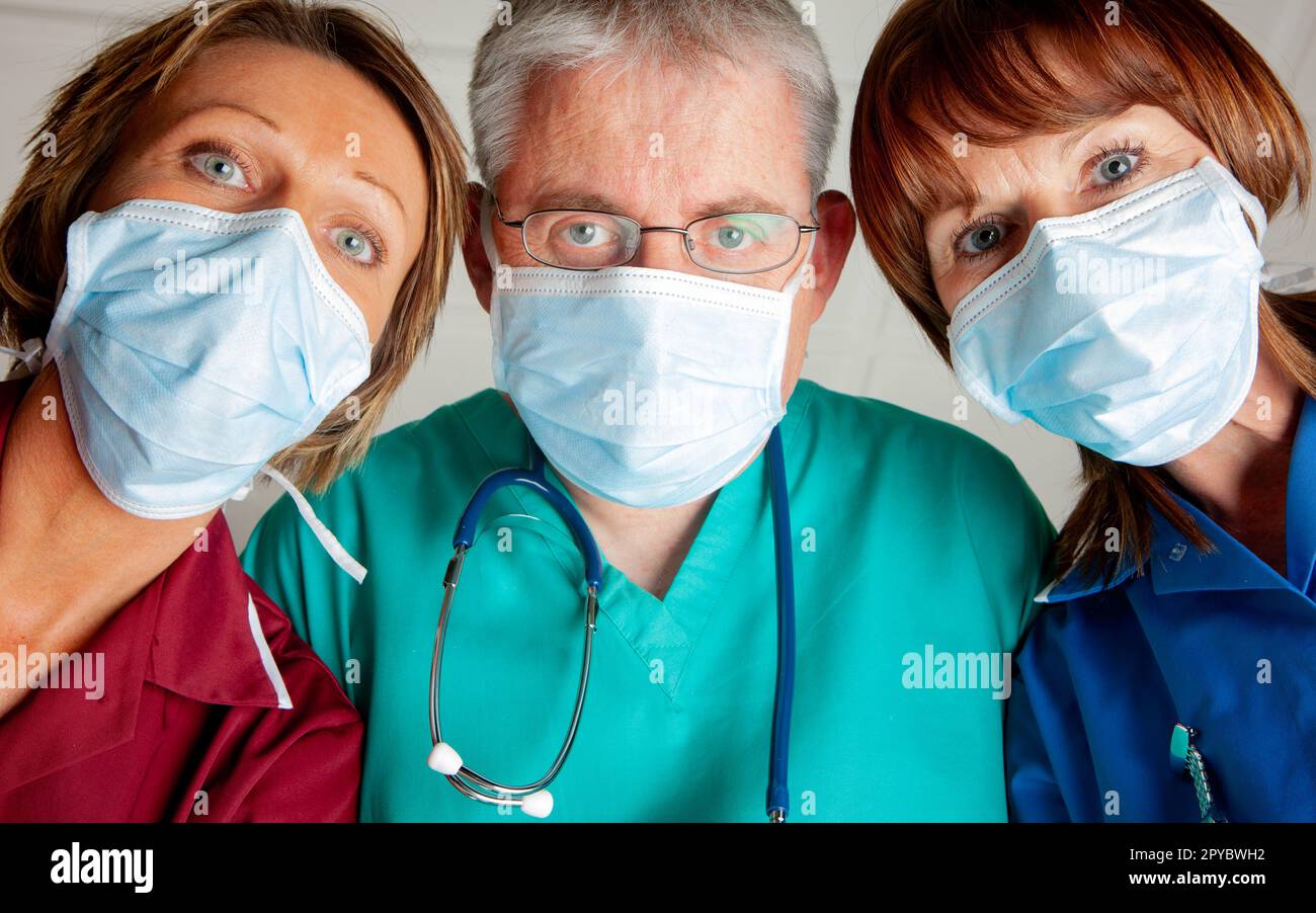 Health Professionals: Medical Observation. A concerned masked surgical ...