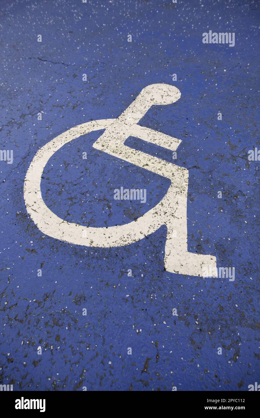 Disabled sign on the asphalt Stock Photo - Alamy