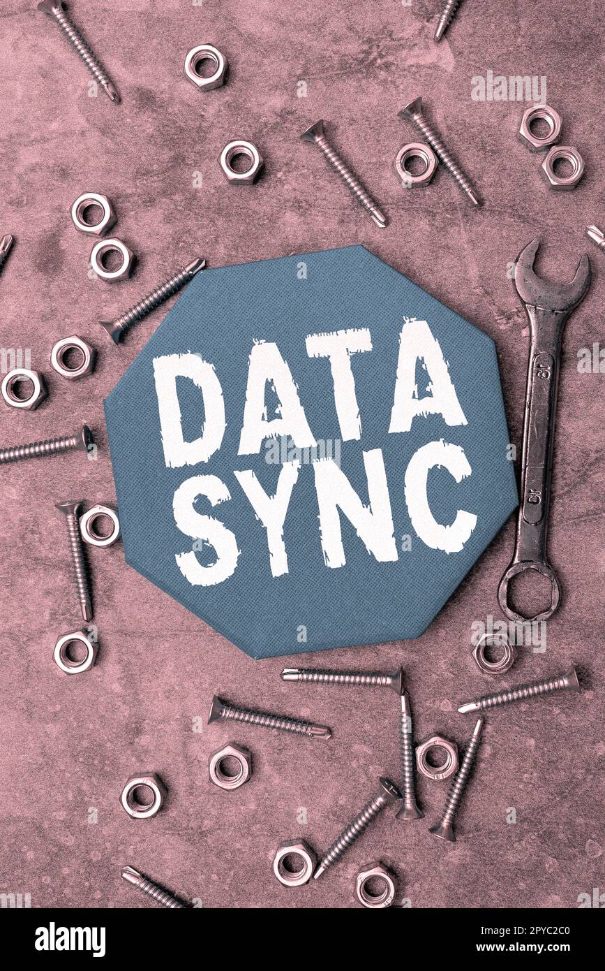 Sign displaying Data Sync. Internet Concept data that is continuously generated by different ...