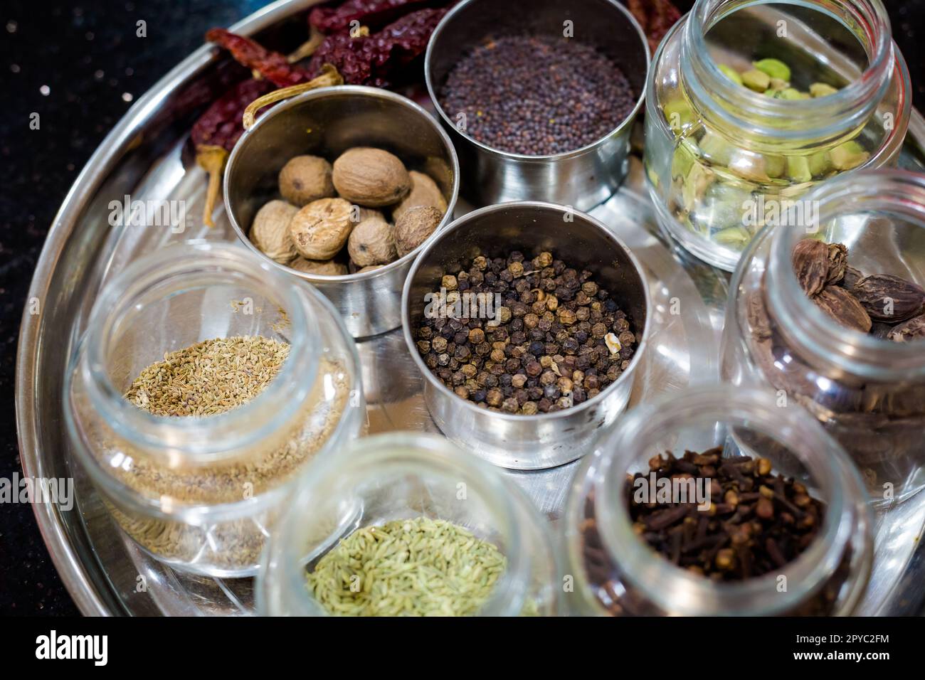 Traditional way of preparing indian food - fresh herbs and spices ...