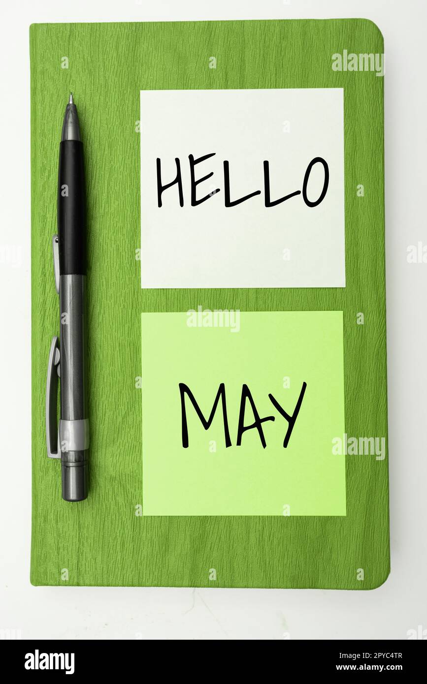 Sign displaying Hello May. Word Written on to address the fifth month ...