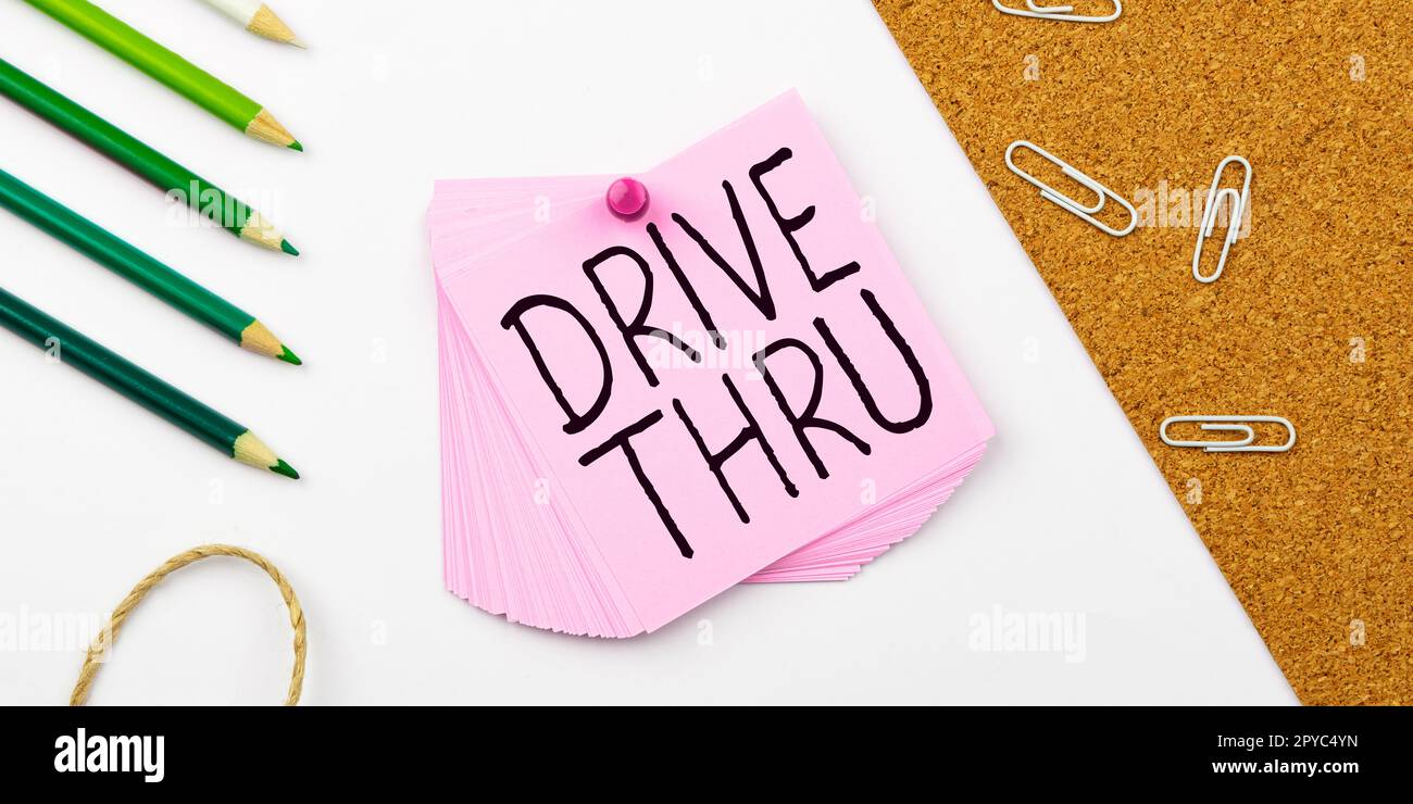 Hand writing sign Drive Thru. Business approach place where you can get ...