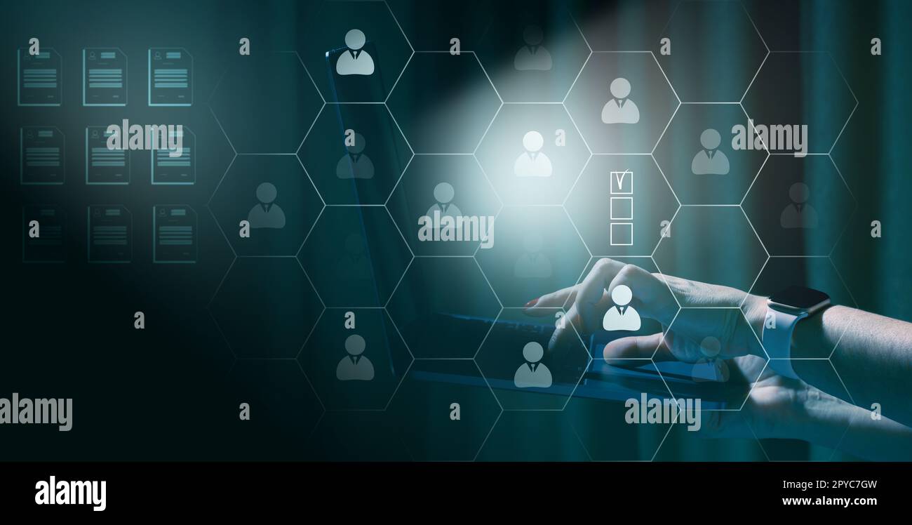 A woman holding a laptop and employee icons, documents, concept of ...