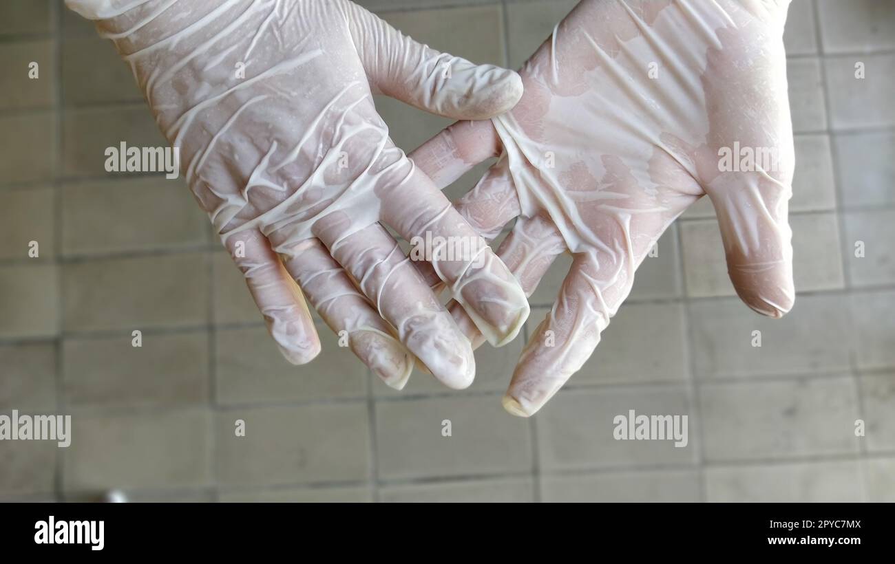 Hands in surgical gloves. Gestures, rubbing hands. Hand Wearing Medical ...