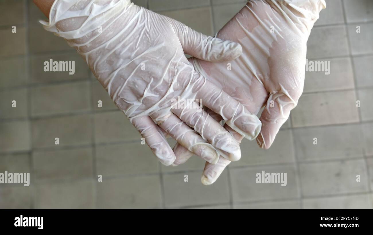 Hands in surgical gloves. Gestures, rubbing hands. Hand Wearing Medical ...