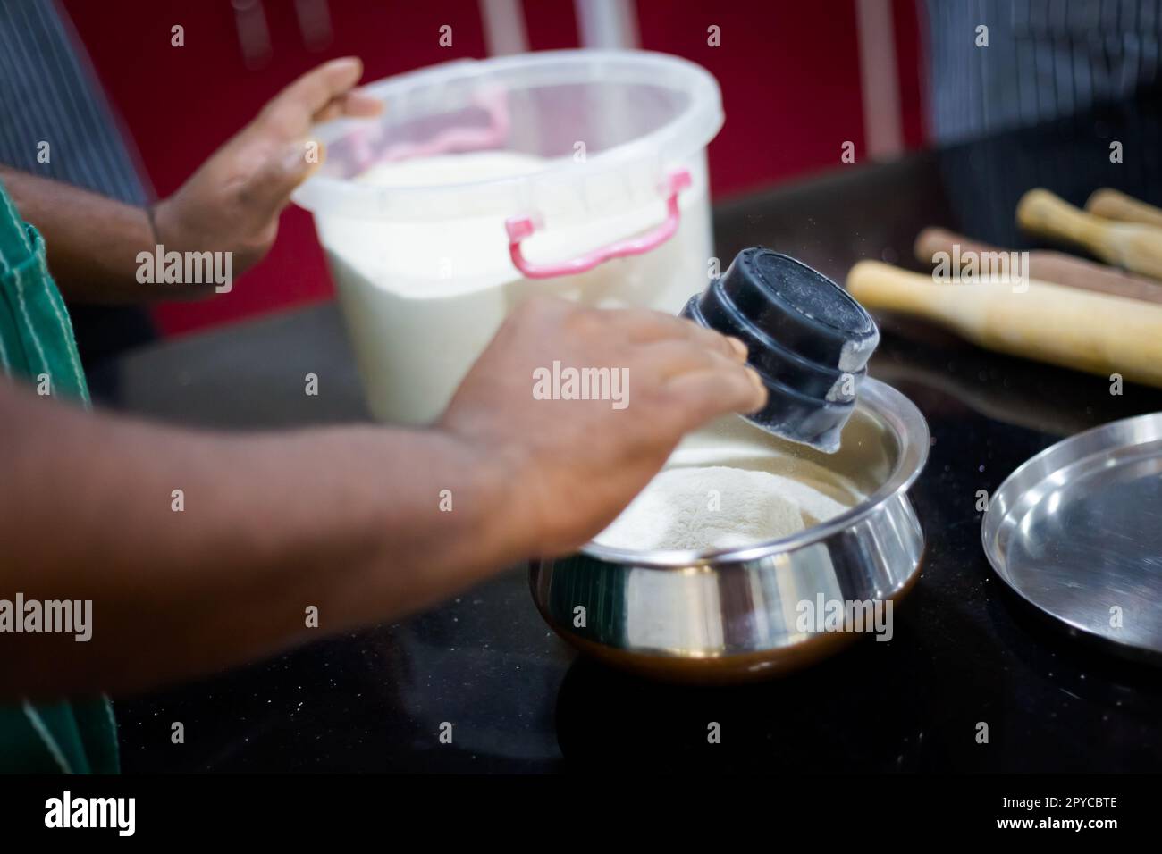Traditional way of preparing indian food, making roti bread. Picture of ...