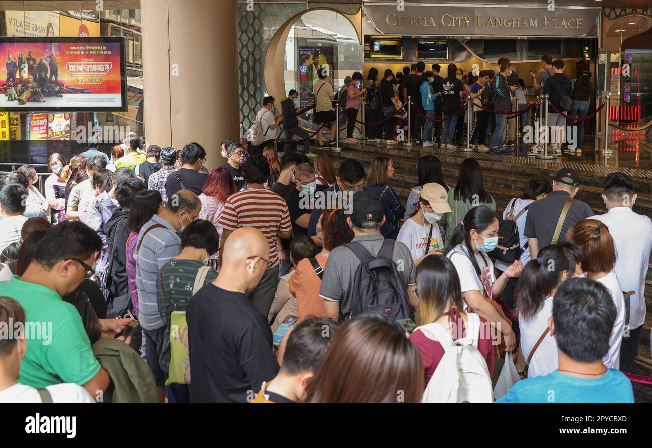 Dozens of people queue up to buy movie tickets outside a cinema in Mong ...