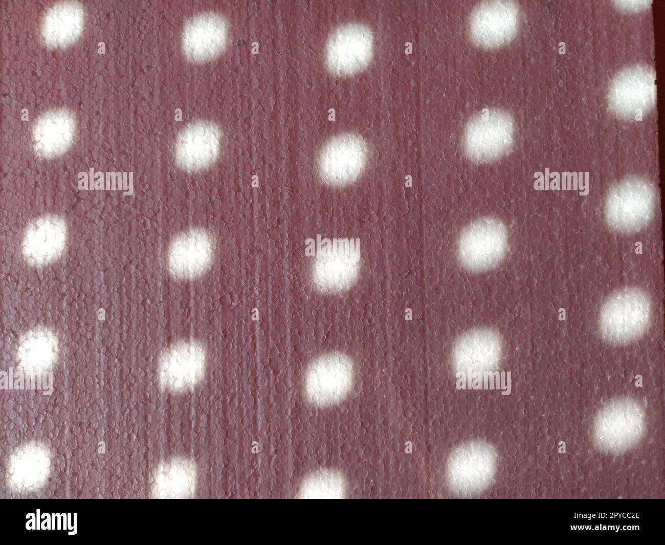 Red background with polka dots. Rays of the sun shining through the ...