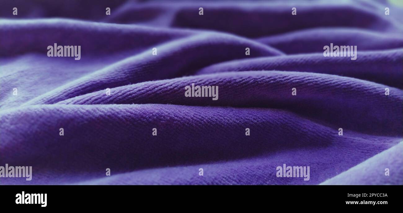 Blue wrinkled velvet. Blue-violet velvet fabric, beautifully laid in ...