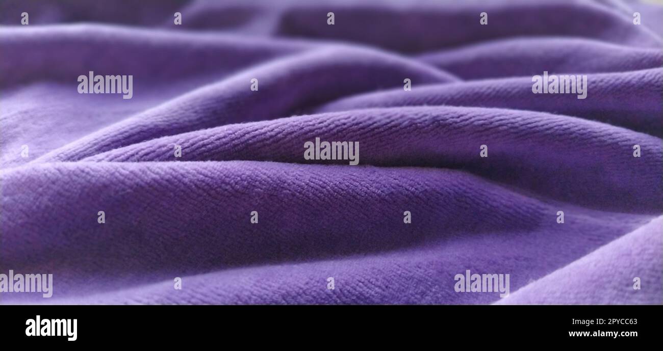 Purple velvet. Soft fabric. Blurred edges of the photo. Soft lilac ...