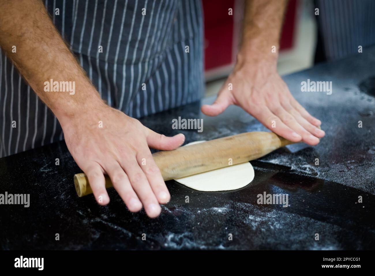 Traditional way of preparing indian food, making roti bread. Picture of ...