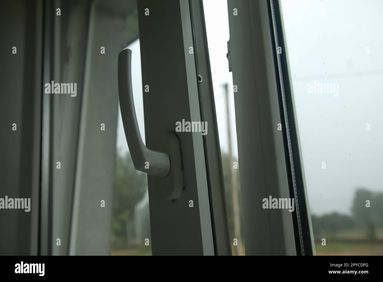 Open window in rainy weather. Cold winter weather. A wet window during ...