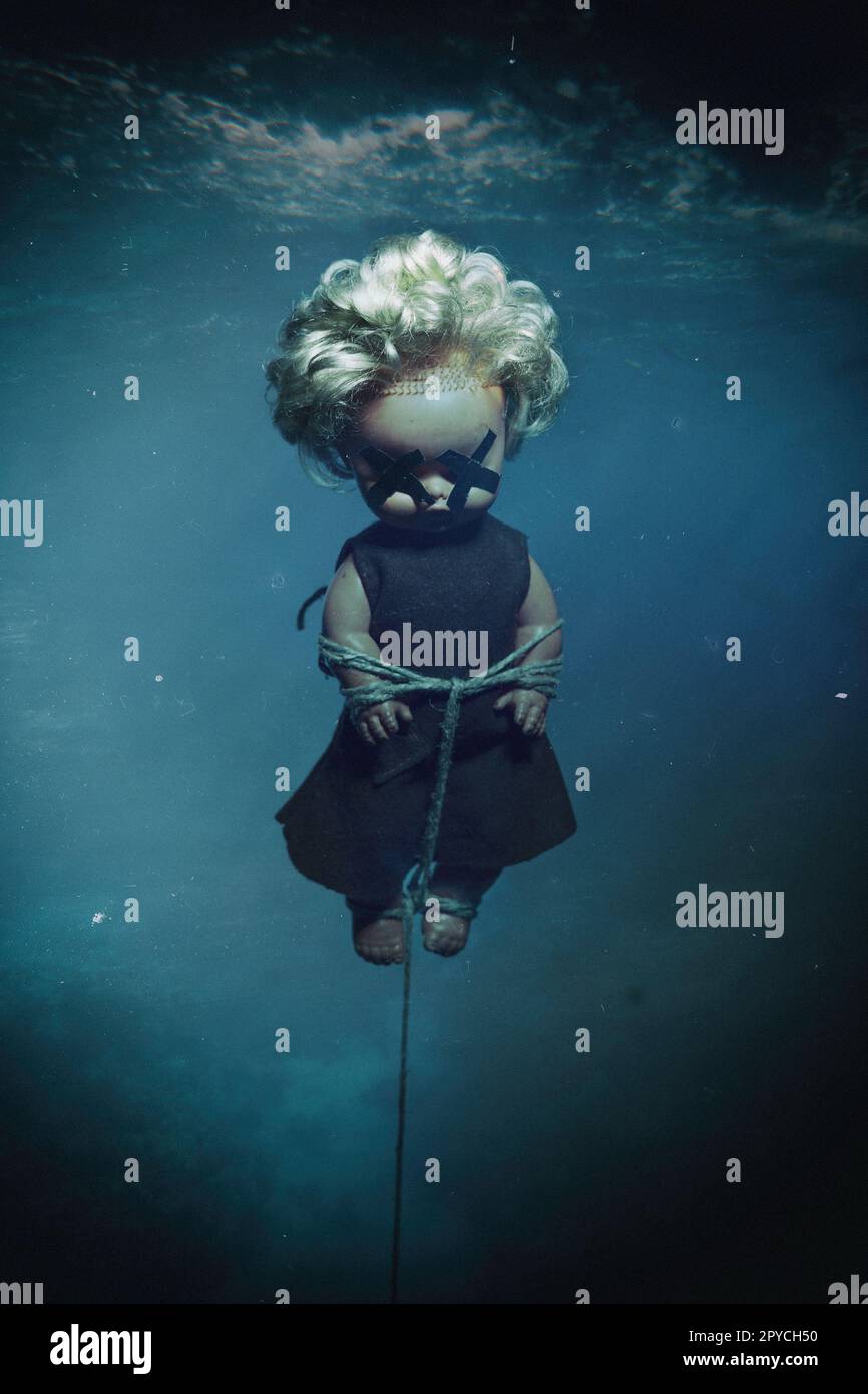 bound doll underwater Stock Photo - Alamy