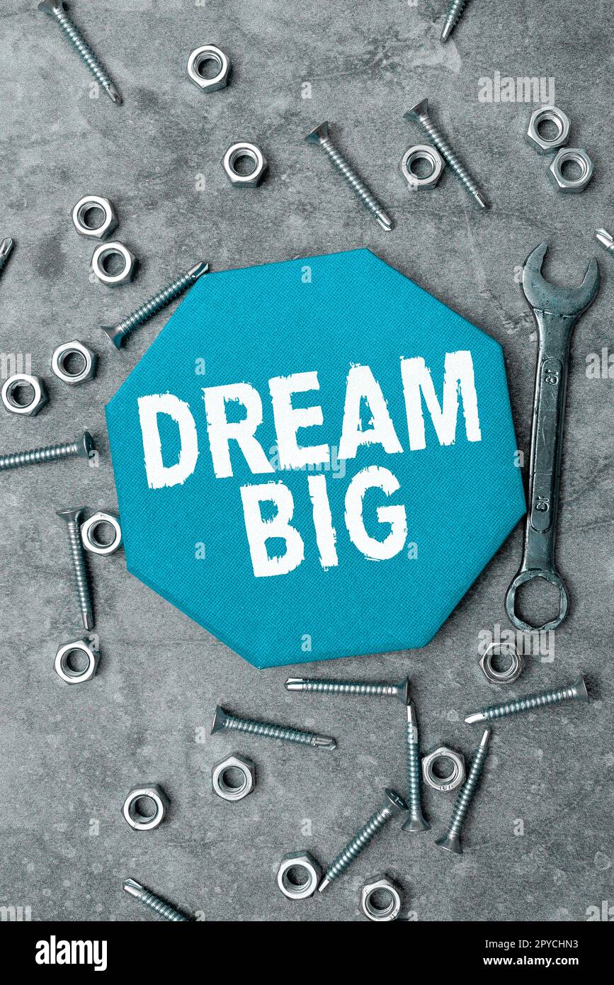 Hand writing sign Dream Big. Concept meaning To think of something high ...