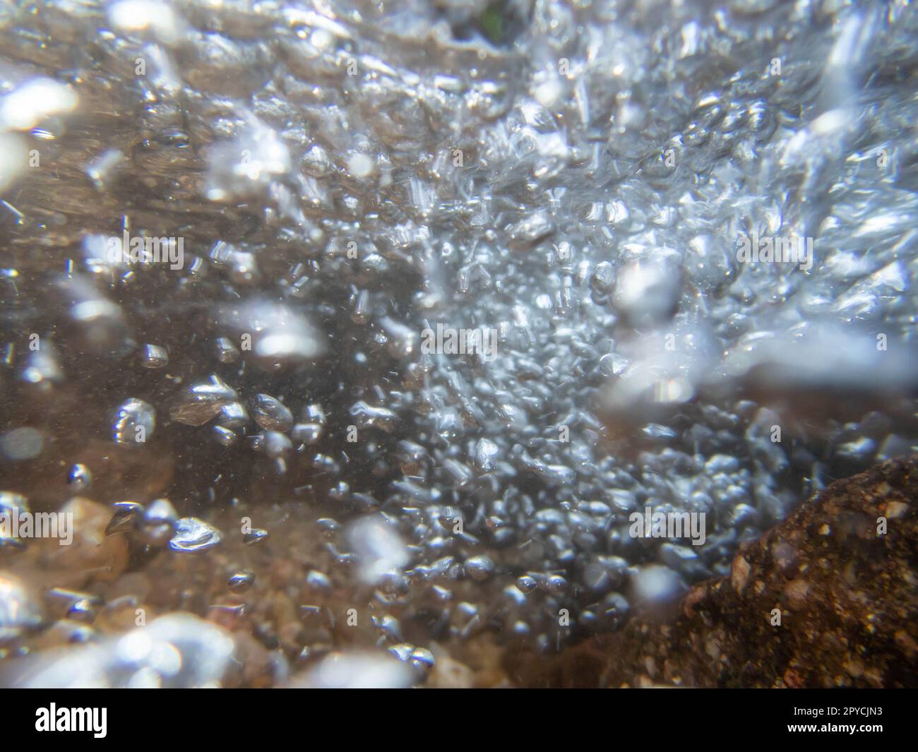 Underwater view of swirling bubbles in a fast moving stream Stock Photo ...