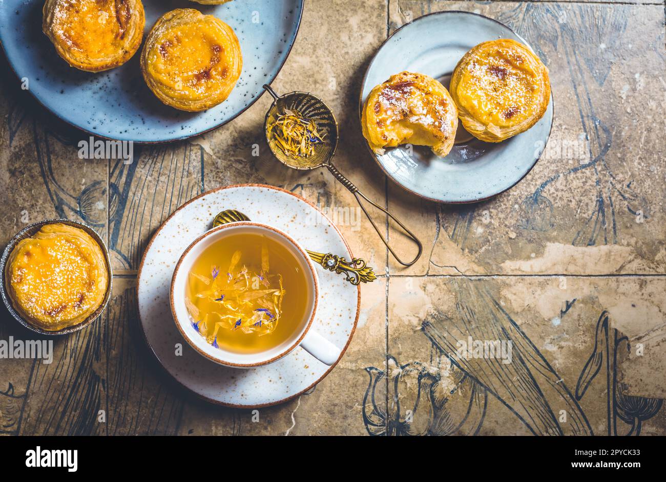 Pastel de nata with cup of herbal tea, Portugal sweet egg and pudding ...