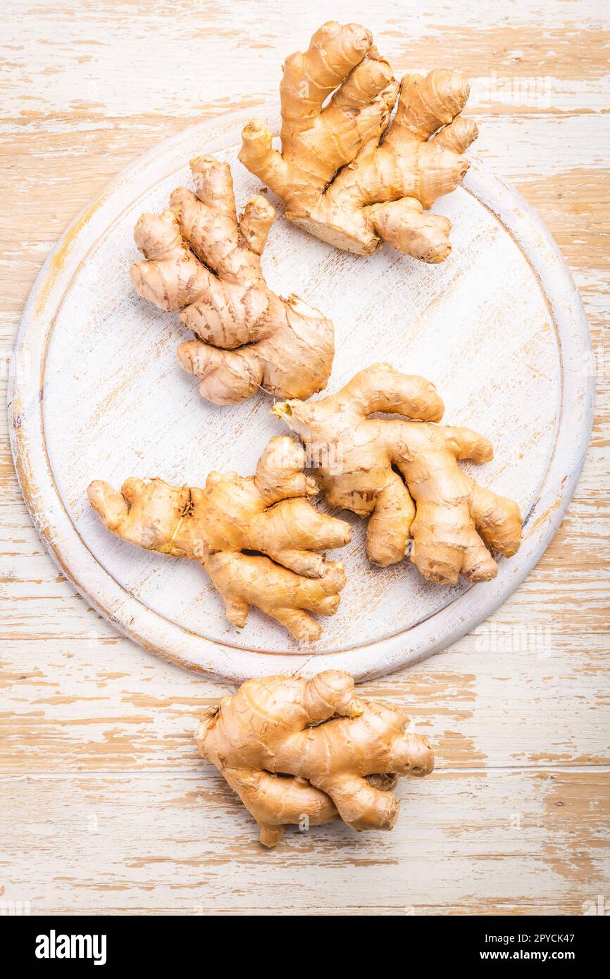 Fresh ginger on wooden hi-res stock photography and images - Alamy