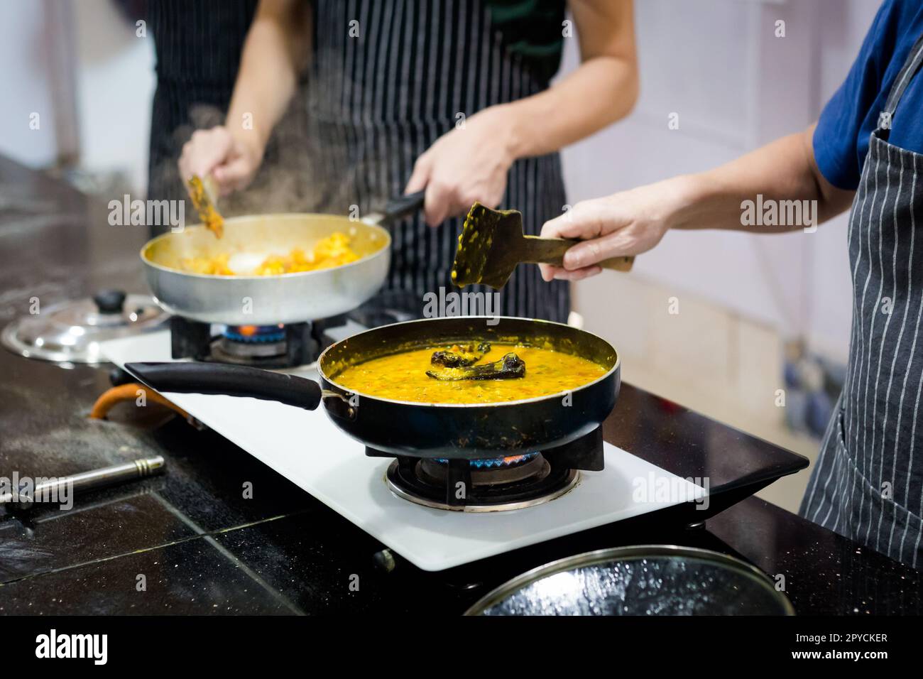 Traditional way of preparing indian food using gas pan. Picture of ...