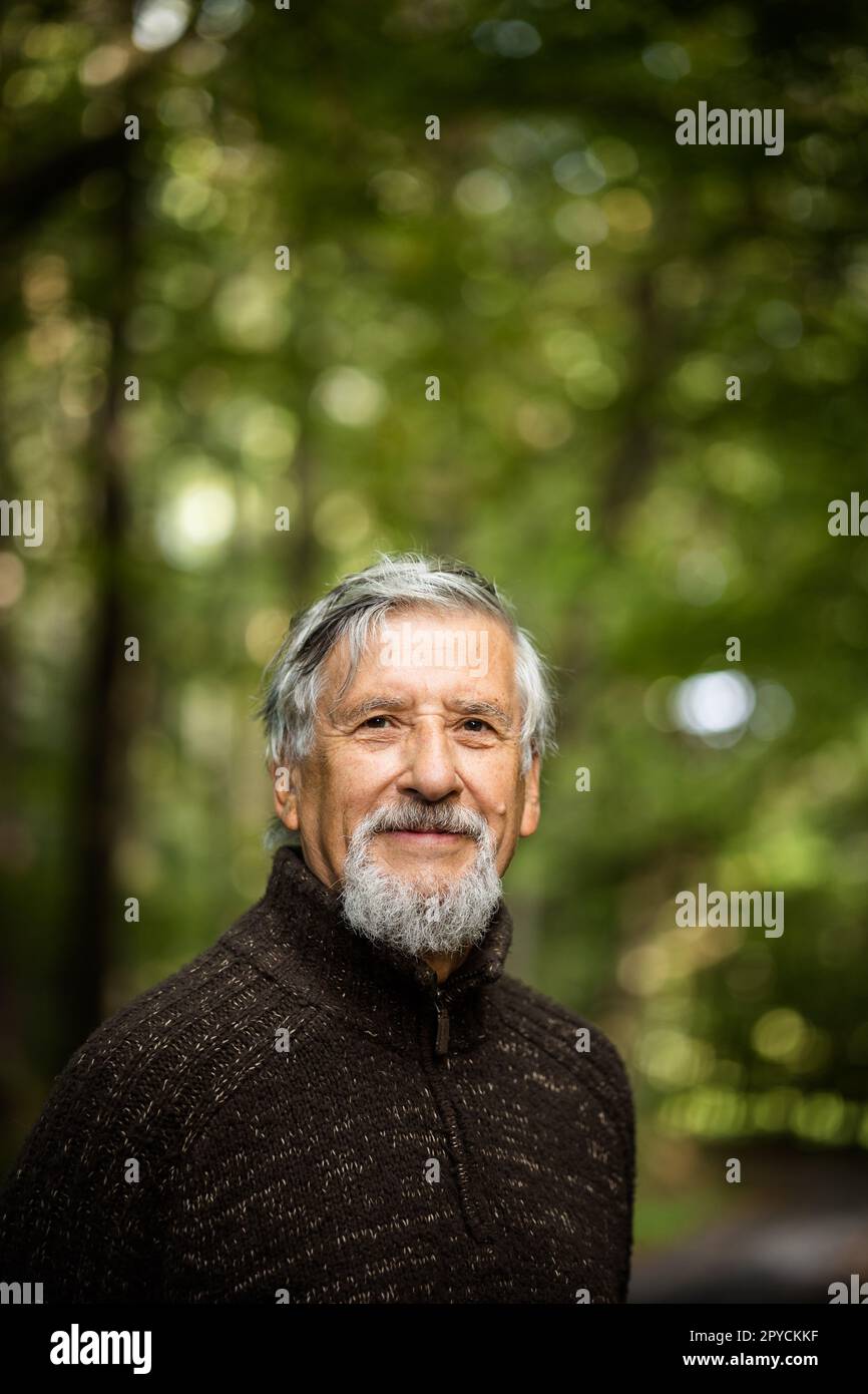 Elderly caucasian male walking outdoors on an autumn, fall day Stock ...
