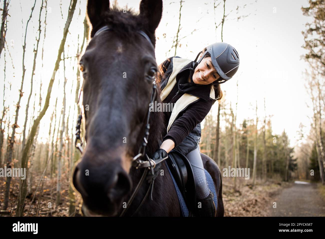 Female horse rider riding outdoors on her lovely horse Stock Photo - Alamy