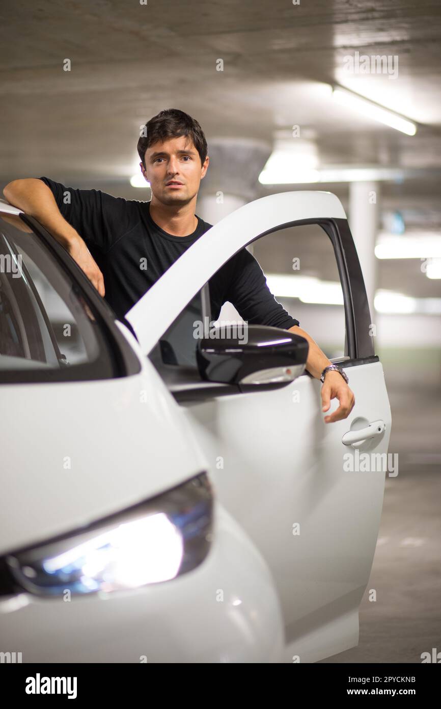 Underground parking/garage (shallow DOF color toned image) - young male ...