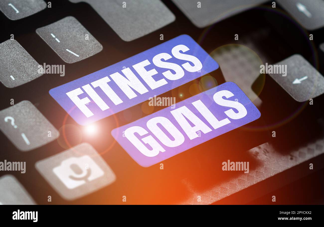 Text showing inspiration Fitness Goals. Word for Loose fat Build muscle ...