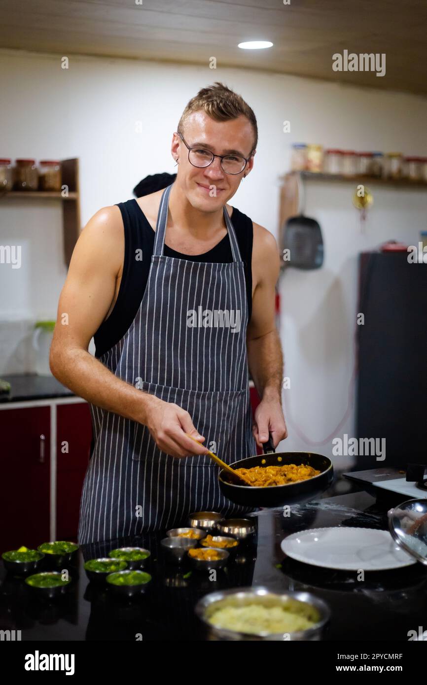 Young indian man preparing lunch hi-res stock photography and images ...