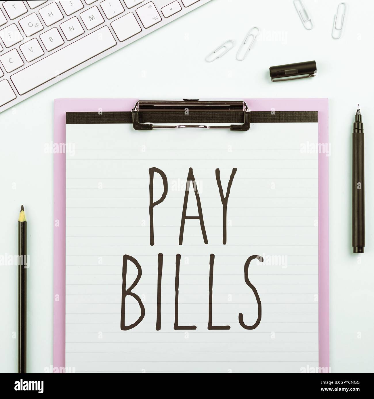 Hand writing sign Pay Bills. Internet Concept list of expenses to be ...