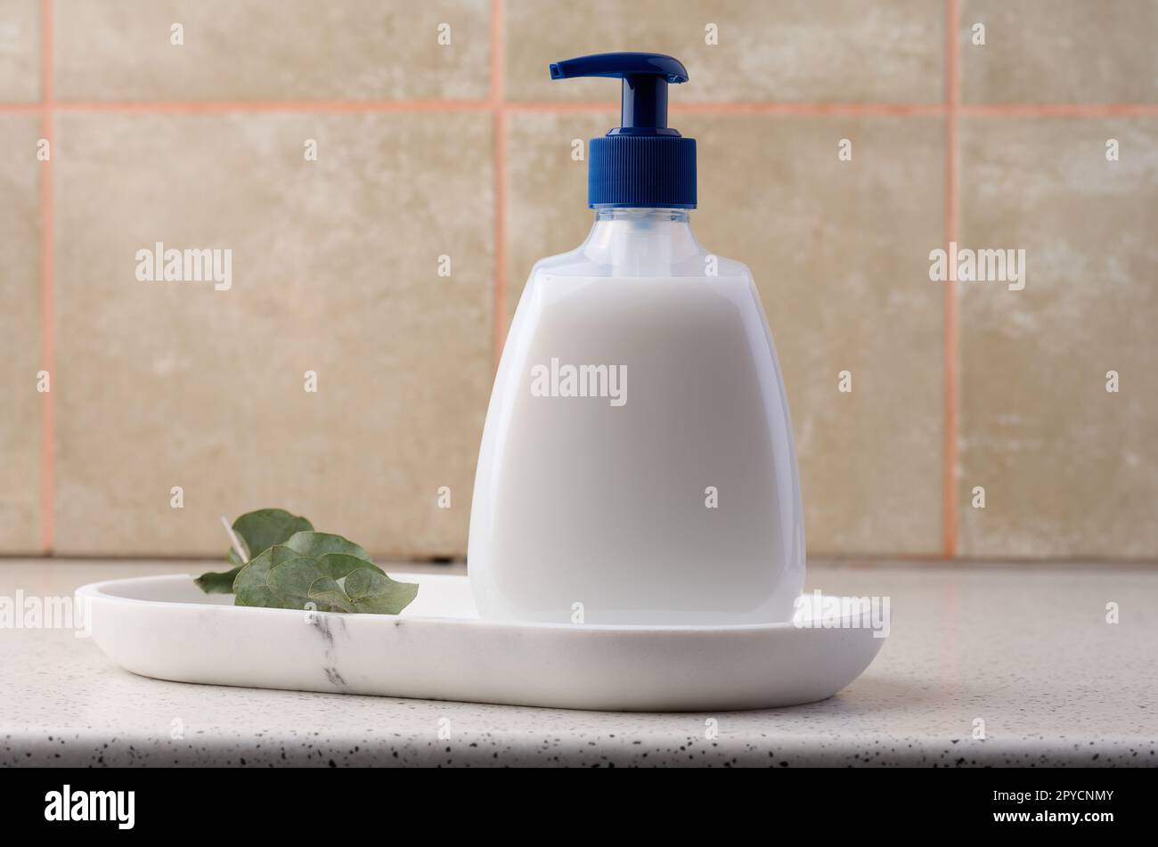 White plastic container with a pump for liquid products. Container for ...