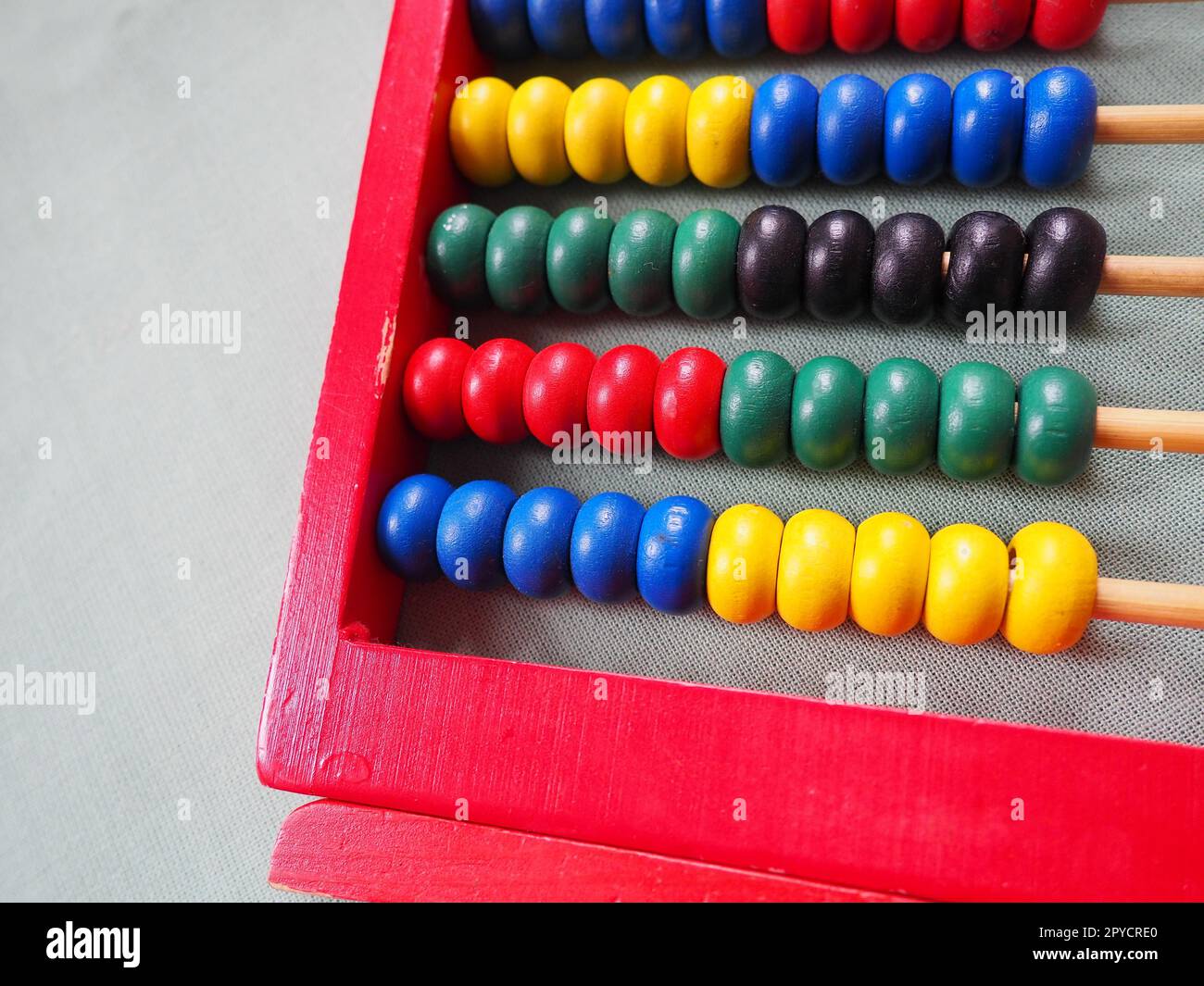 Education concept - abacus with many colorful beads. Red, blue, green ...