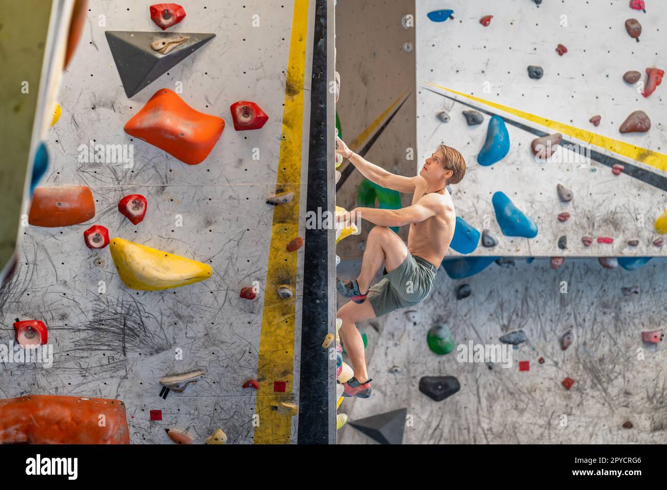 bouldering on an artificial climbing wall Stock Photo - Alamy