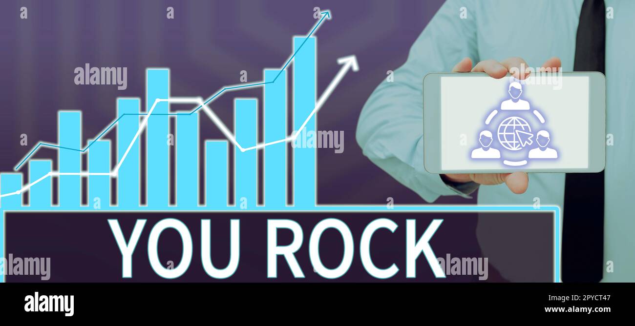 Hand writing sign You Rock. Word for slang phrase of praise or ...