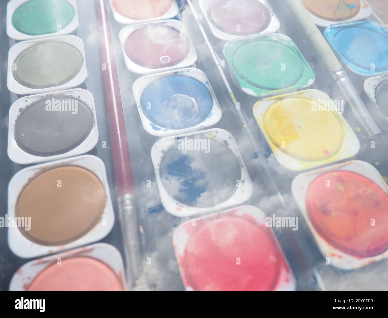 A set of watercolors of different colors for painting. Multi-colored ...