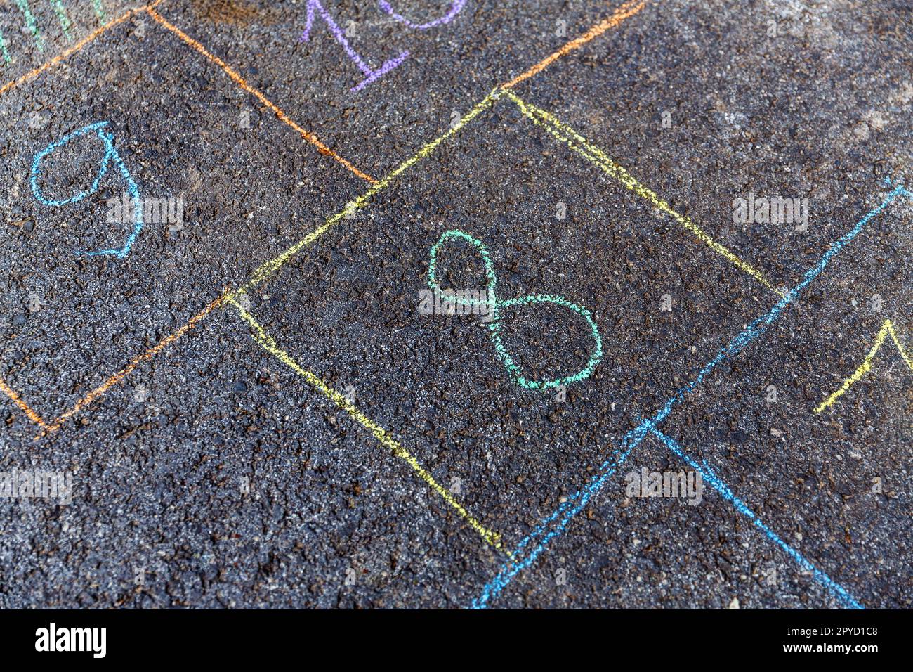 leisure games and childhood concept - close up of hopscotch chalk ...