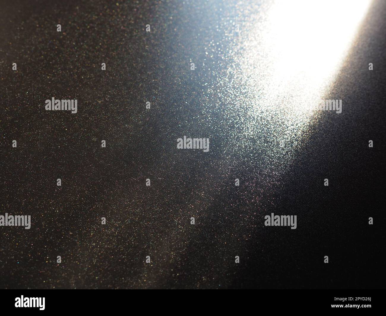 Abstract black background. Oblique light rays on a black blackdrop with ...