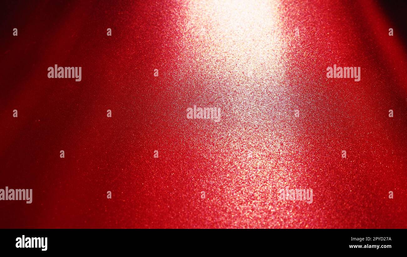 Diagonal rays of light on a red or scarlet background. Blurred abstract ...