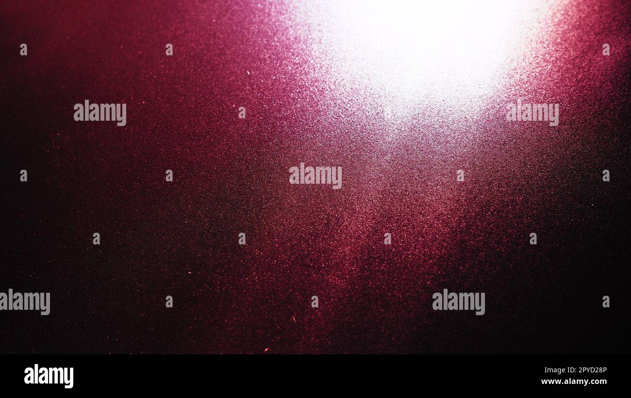 Diagonal rays of light on a red, burgundy and black background. Blurred ...