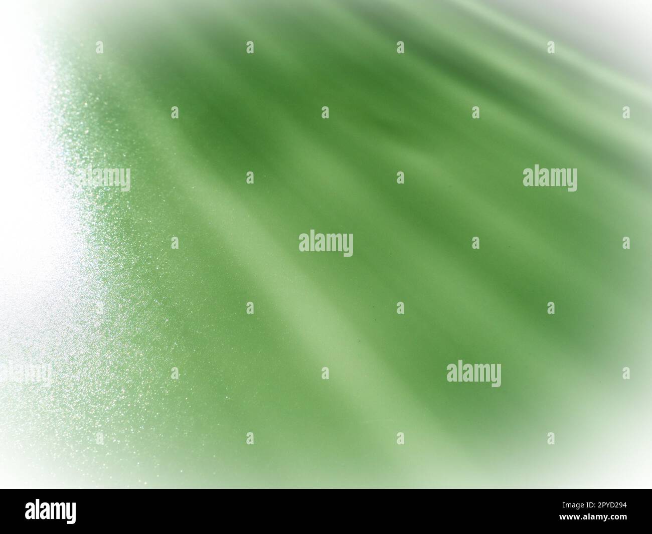 Diagonal rays of light on green background. Blurred abstract background ...