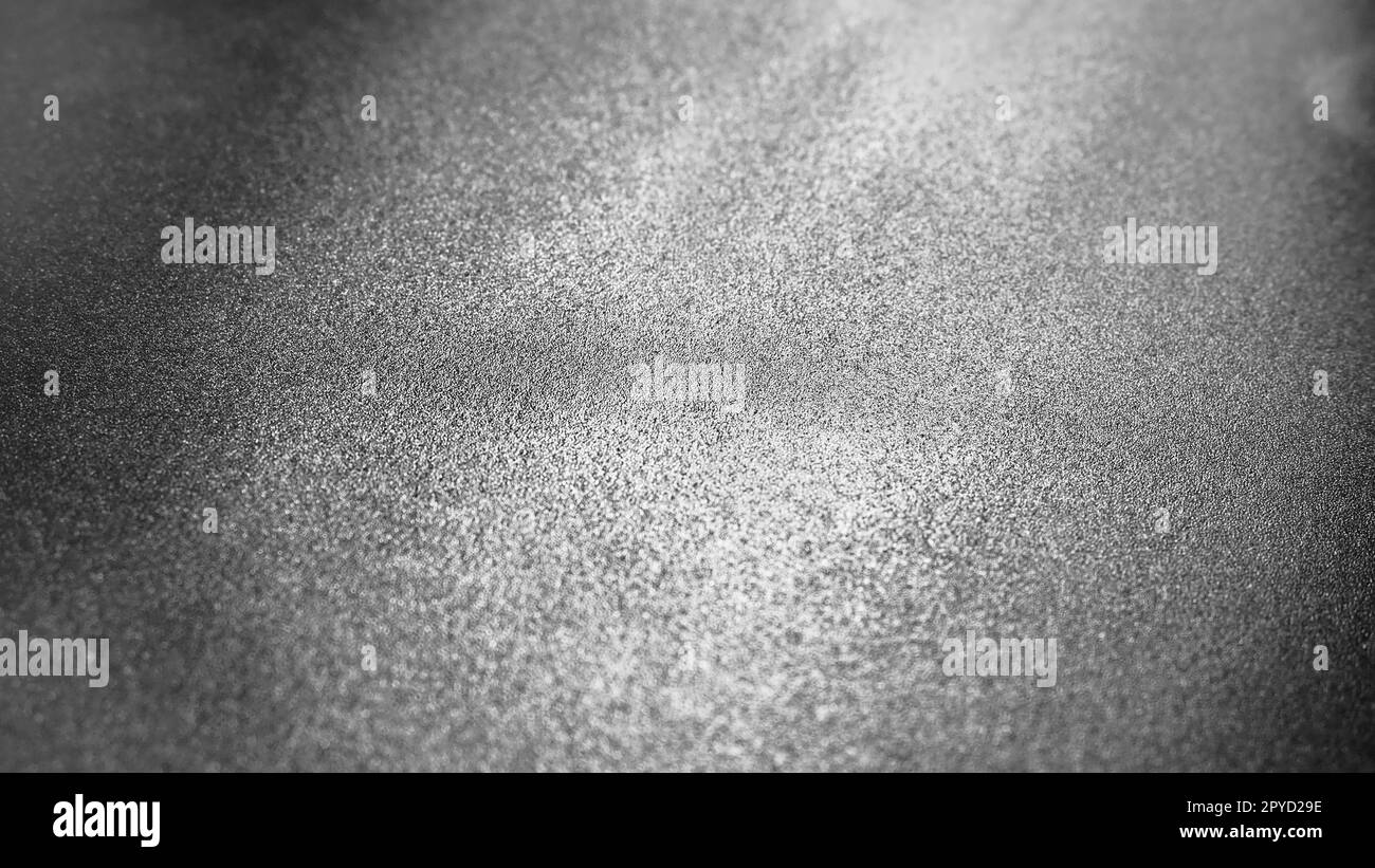 Abstract gray background with gradient, coarse grain. Selective focus ...