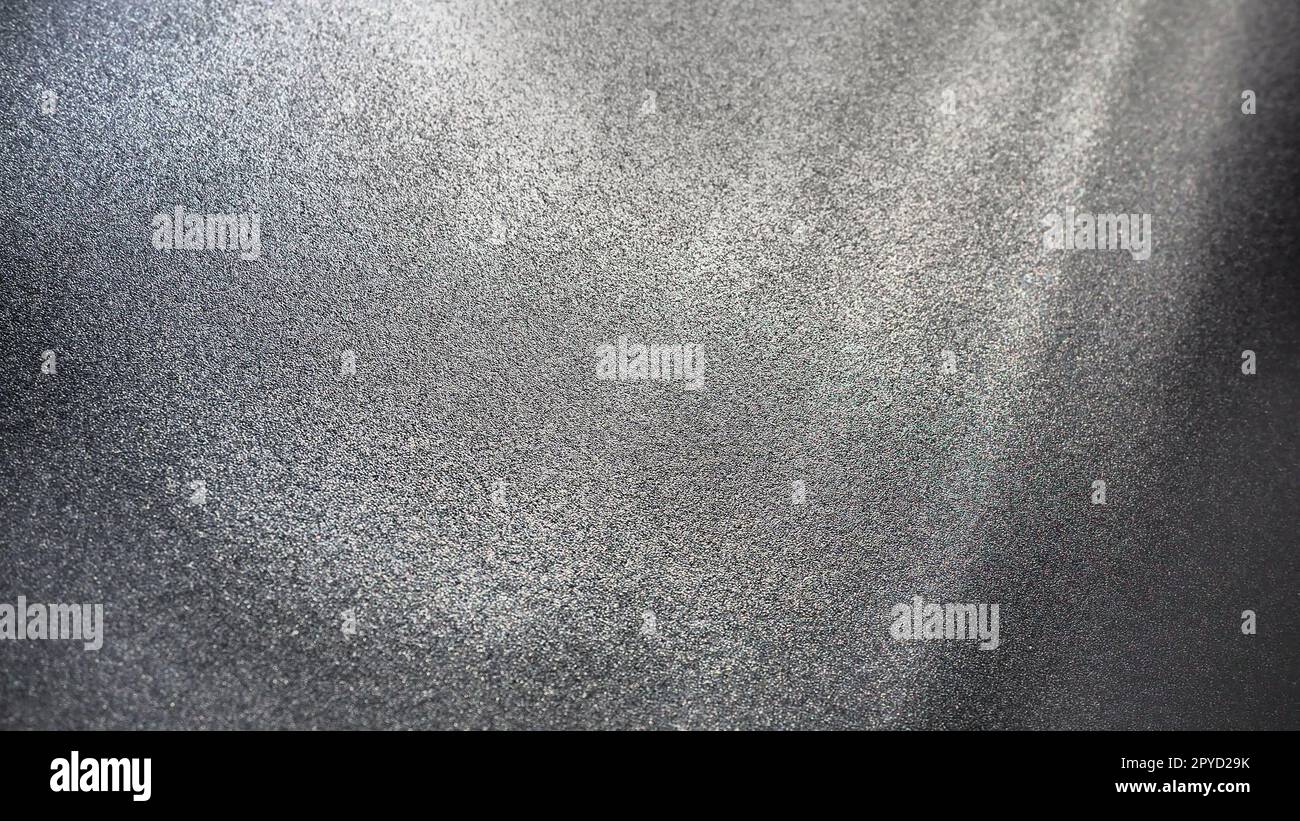 Abstract gray background with gradient, coarse grain. Selective focus ...