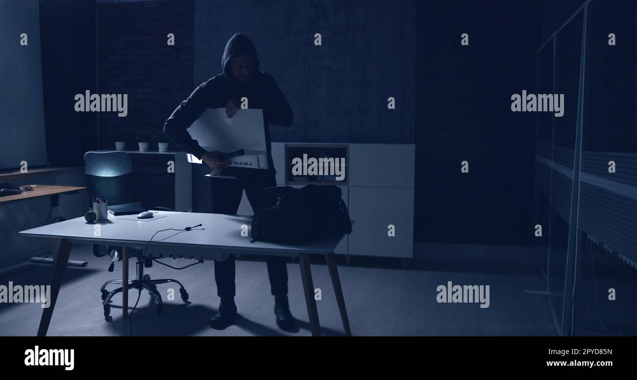 Thief Stealing Computer From Office Stock Photo - Alamy