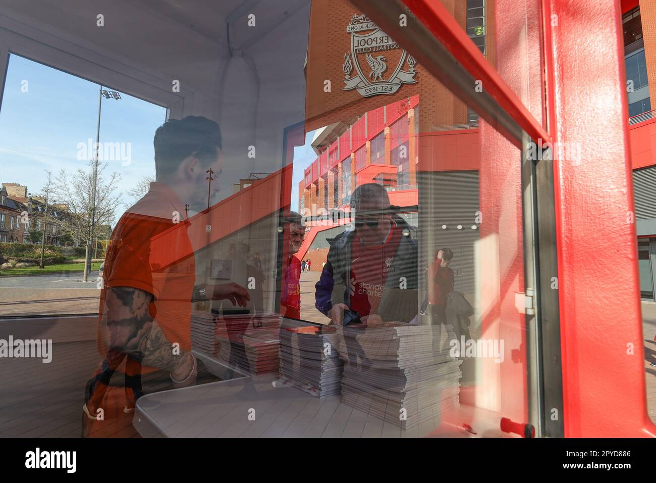 Fans buy match day programmes ahead of the Premier League match ...