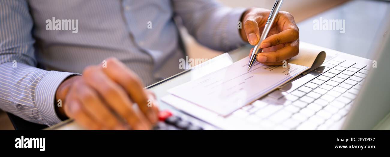 Writing Payroll Compensation Check Stock Photo - Alamy